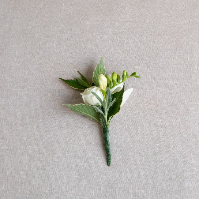 white flower buttonhole